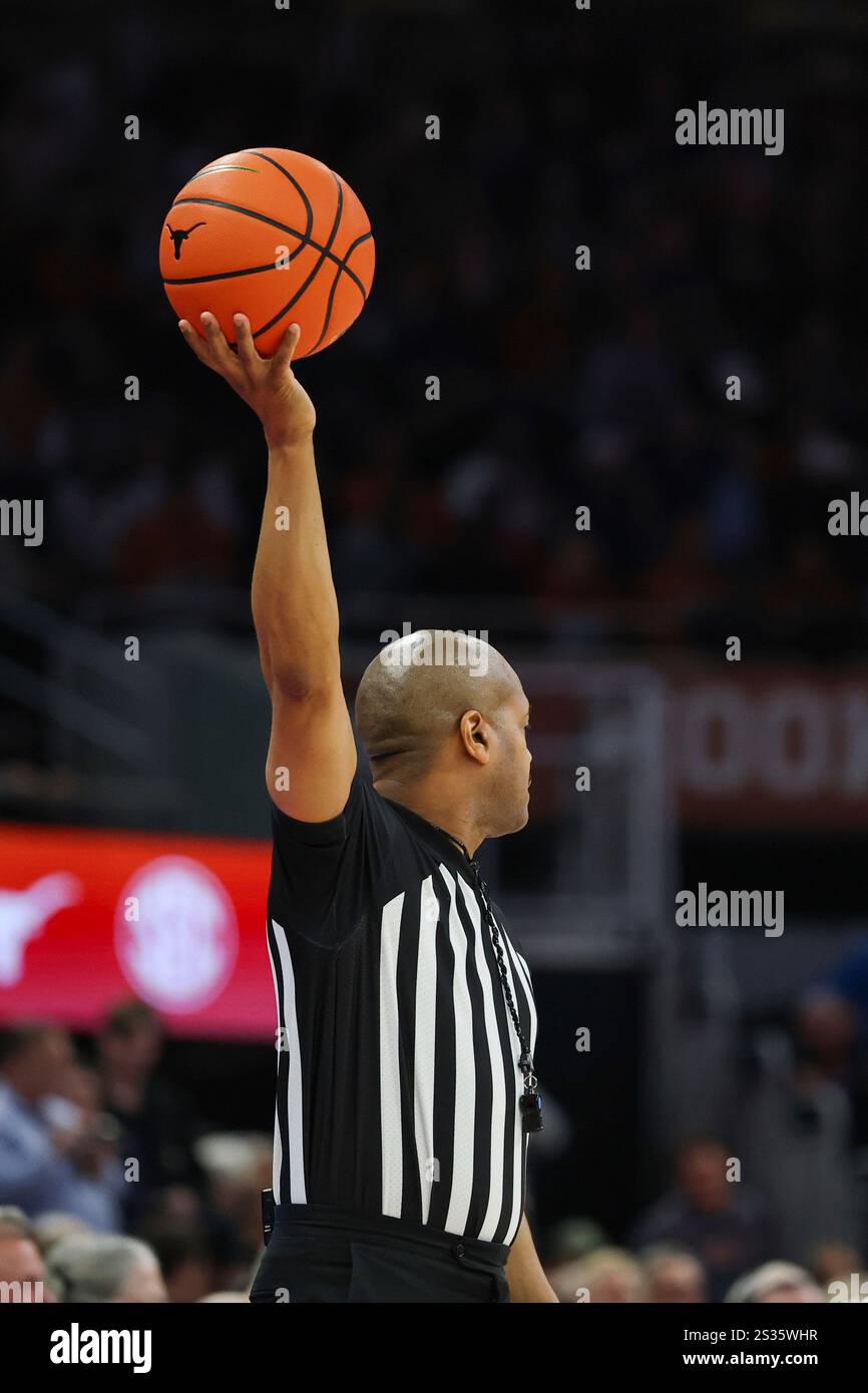 AUSTIN, TX - JANUARY 07: A referee holds the ball high after a timeout ...