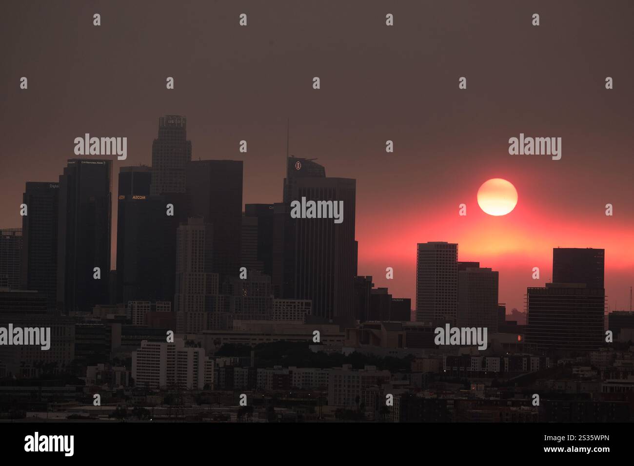 Eerie red sun over downtown Los Angeles as a result of the Eaton and ...