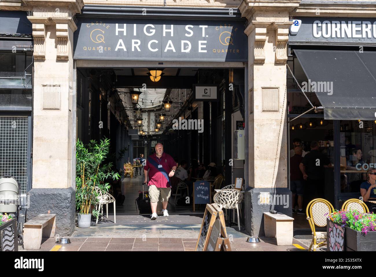 Cardiff Wales - August 6 2024: Man emerges walking from shadow through ...