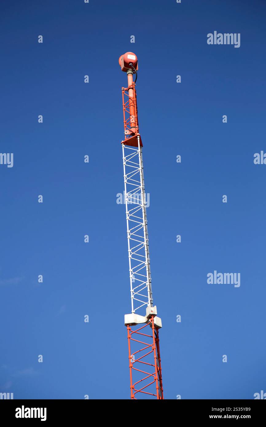 Tall Red and White Communication Tower Against Clear Blue Sky Stock ...