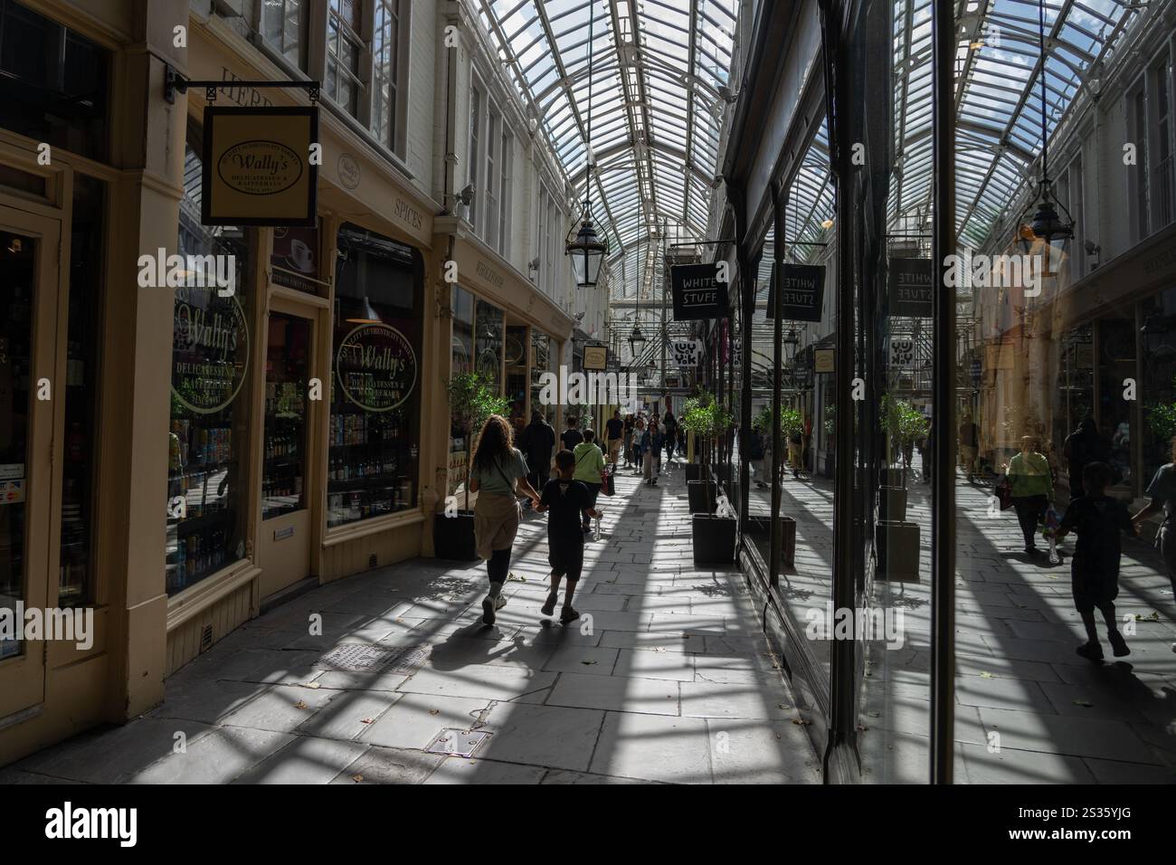 Cardiff Wales - August 6 2024: People and store fronts including Wally ...