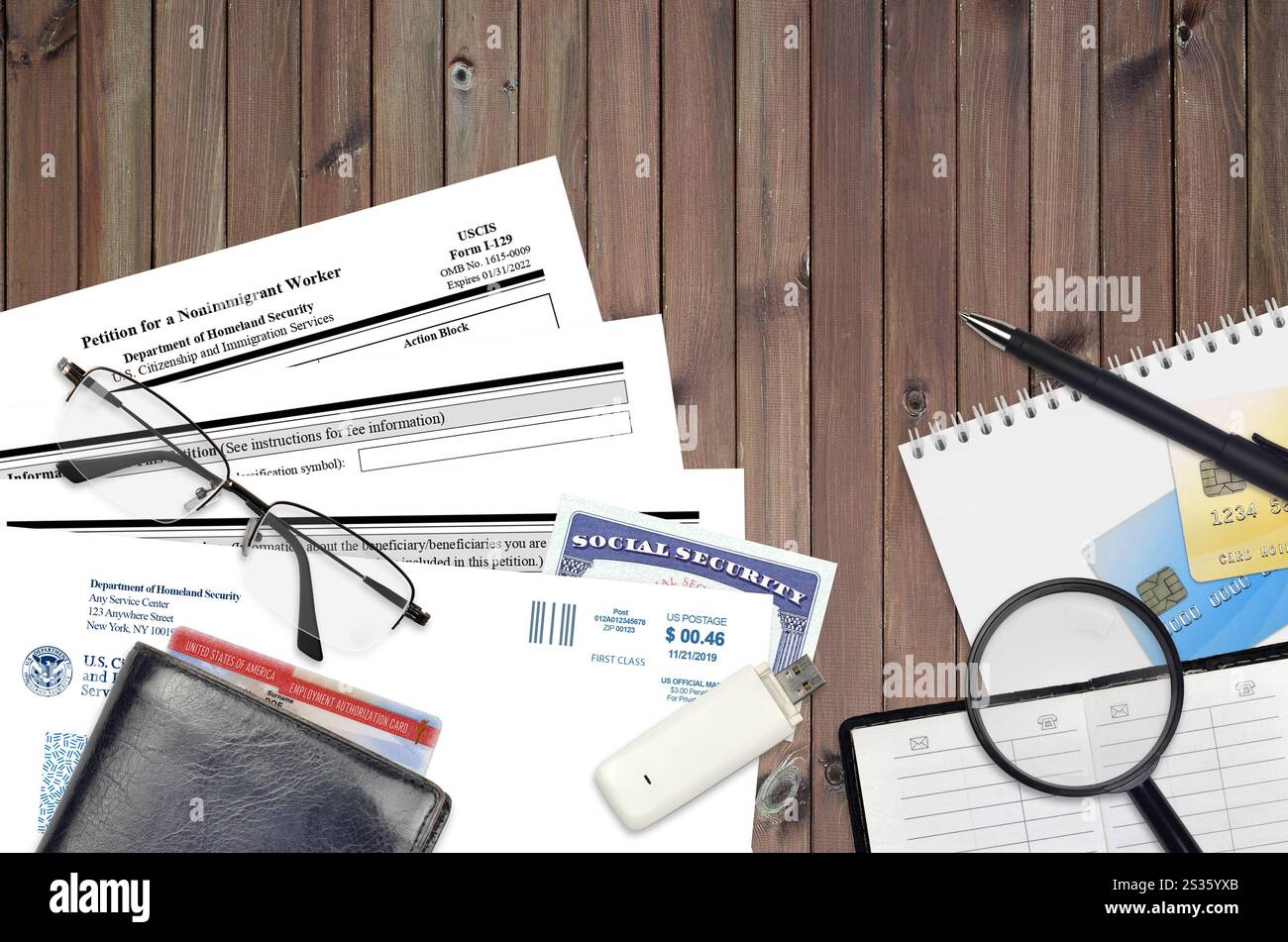 USCIS form I-129 Petition for a nonimmigrant worker lies on flat lay ...