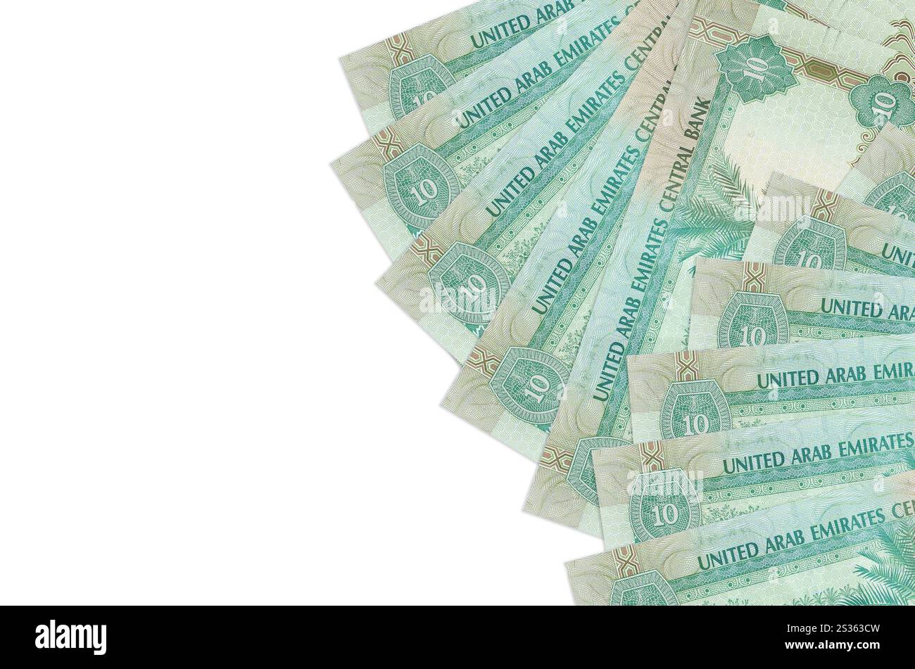 10 UAE dirhams bills lies isolated on white background with copy space ...