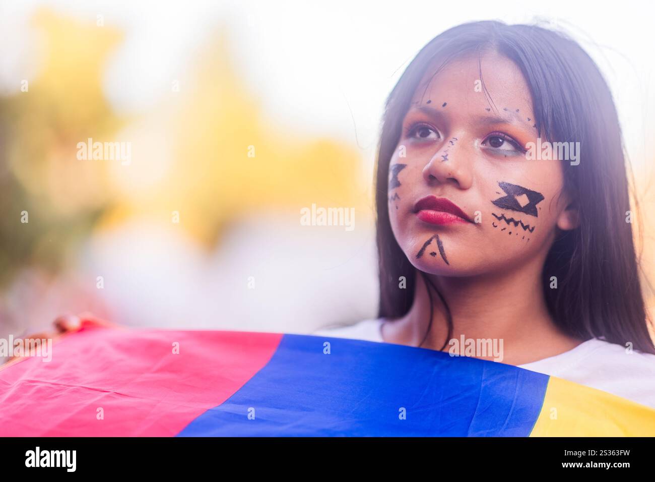 Young woman proudly displaying colombian flag, celebrating dia de la ...