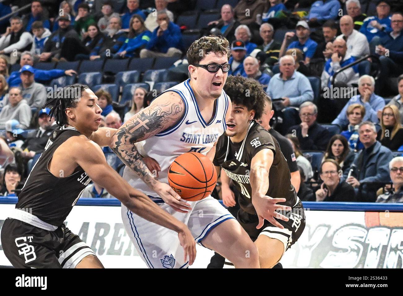 JANUARY 08, 2025: Saint Louis Billikens center Robbie Avila (21) drives ...