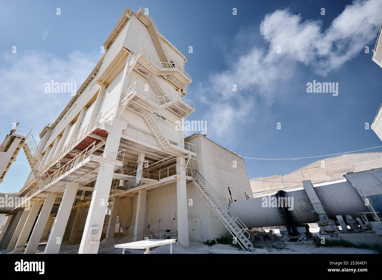 Lime loading unit for railway cars at plant against blue sky Stock ...