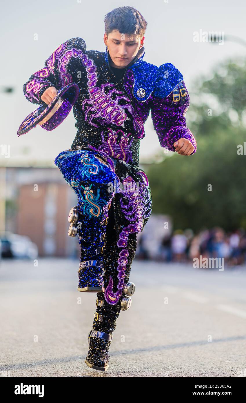 Young dancer wearing elaborate costume with scorpion motif, performing ...
