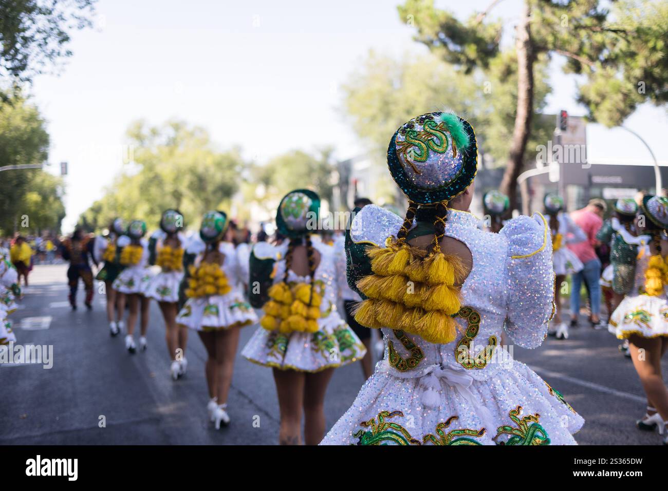 Back view of hispanic dancers wearing traditional clothes and walking ...