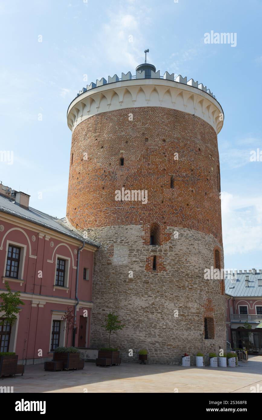 High brick tower in the courtyard of a historic building, watchtower ...