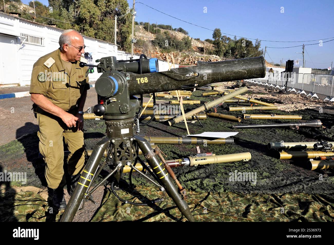 A rocket launcher and other weapons seized from Hezbollah are opened to ...