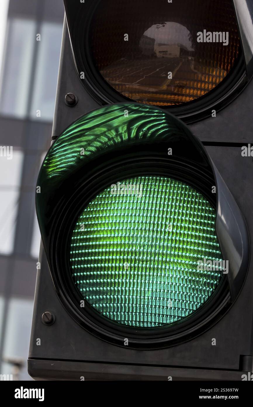 A traffic light shows the green light for free passage across the ...