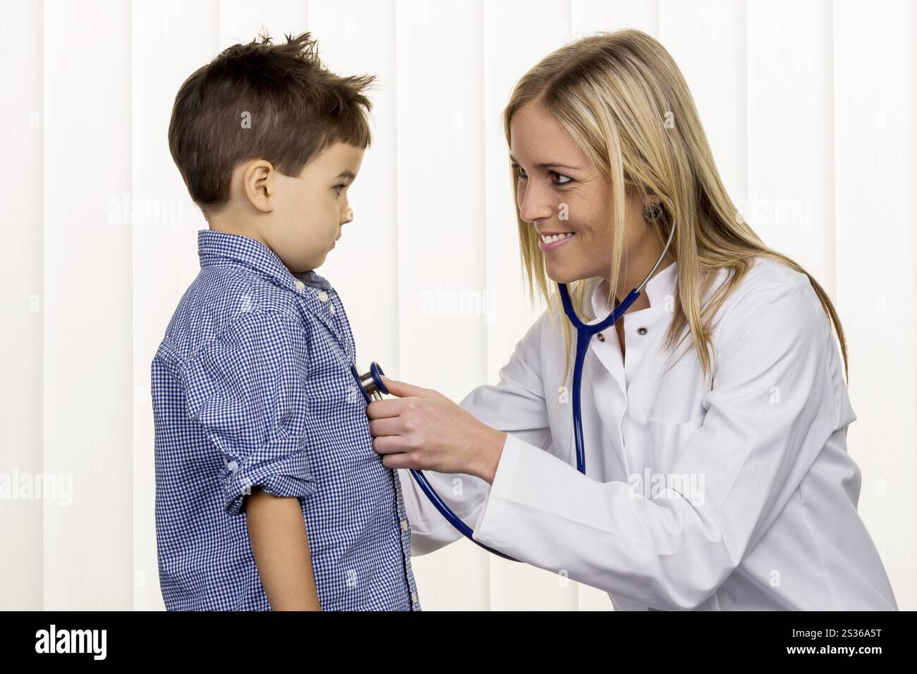 Doctor and little boy, symbol for diseases, diagnostics, heart defects ...