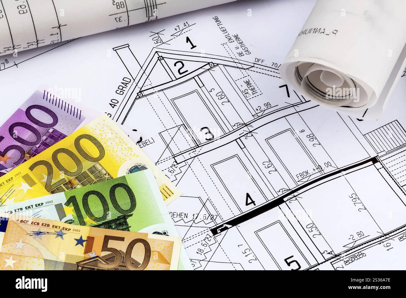 An architect's construction plan with euro money. Symbolic photo for ...