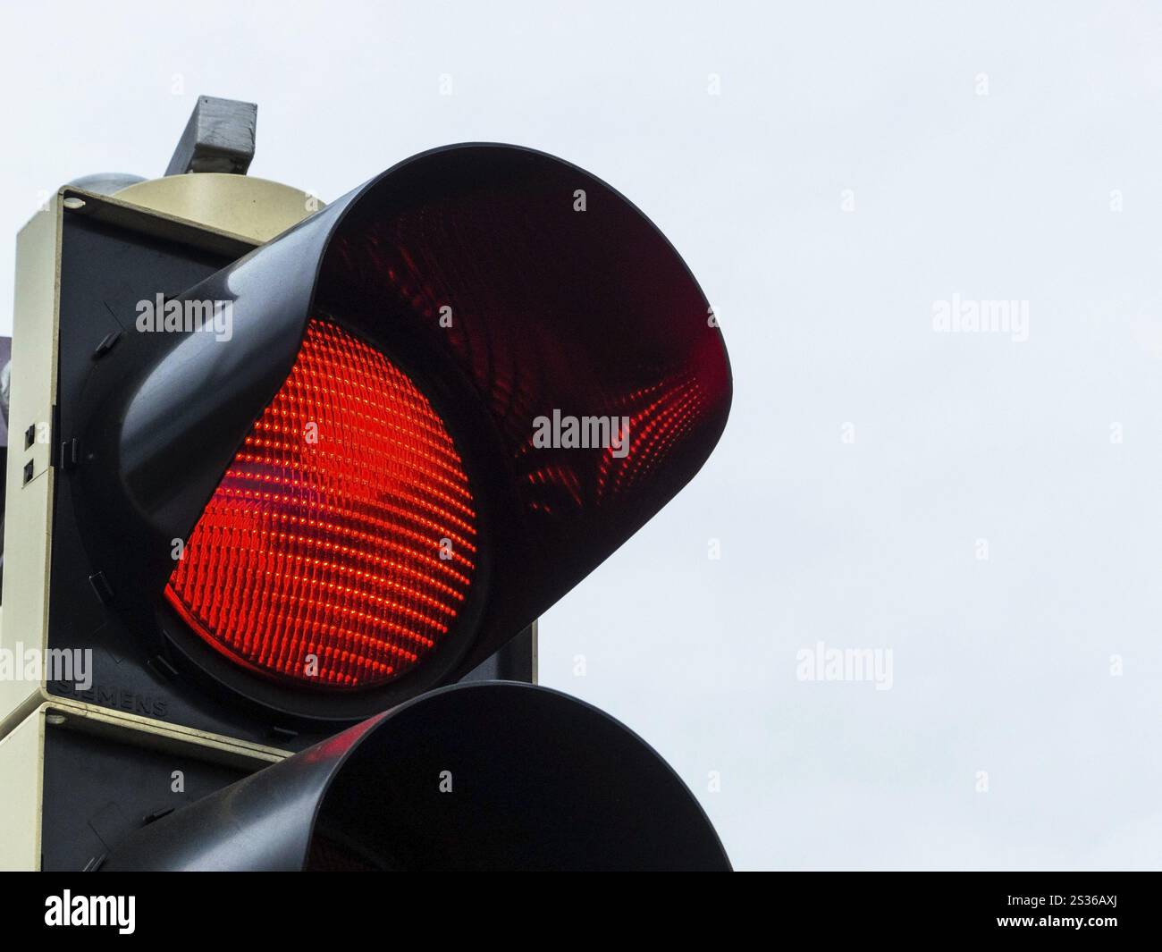 A traffic light shows red. Symbolic photo for stop, exit and danger ...