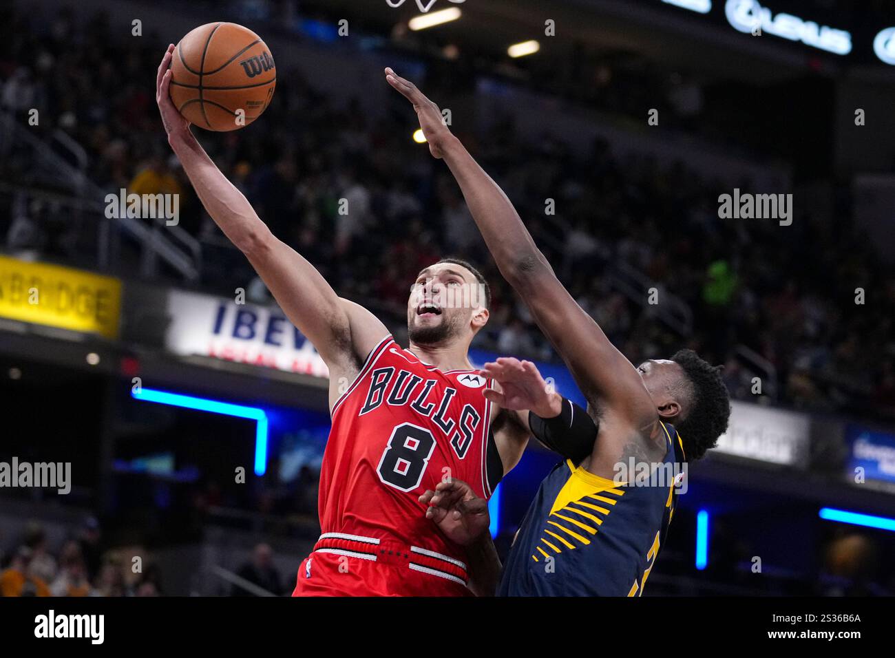 Chicago Bulls guard Zach LaVine (8) shoots around Indiana Pacers center ...