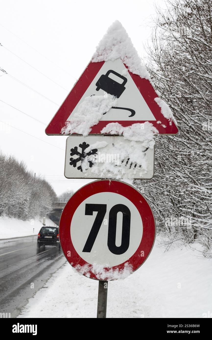 Traffic signs and fresh snow, symbolic photo for winter weather ...