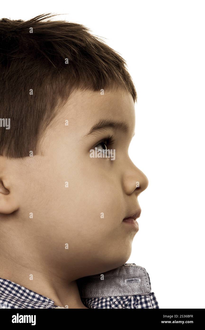 Little boy looks uncertain, symbol of childhood, innocence, scepticism ...