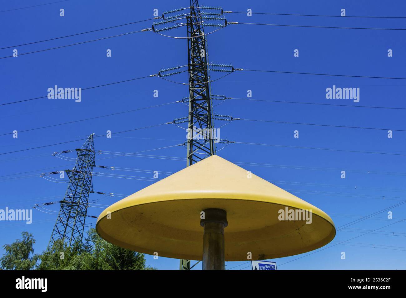 A gas pipeline and an electricity pylon of a high-voltage power line ...