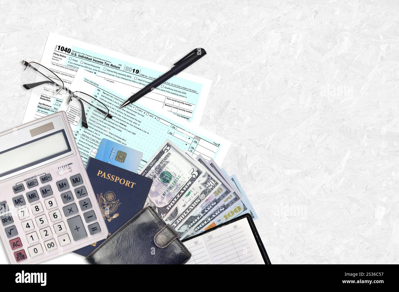 IRS form 1040 Individual income tax return lies on flat lay office ...