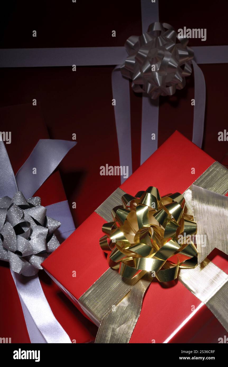 Christmas gift boxes shining in darkness Stock Photo - Alamy