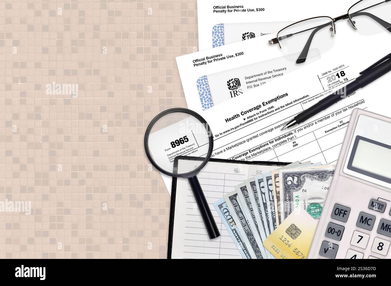 IRS form 8965 Health Coverage Exemptions lies on flat lay office table ...