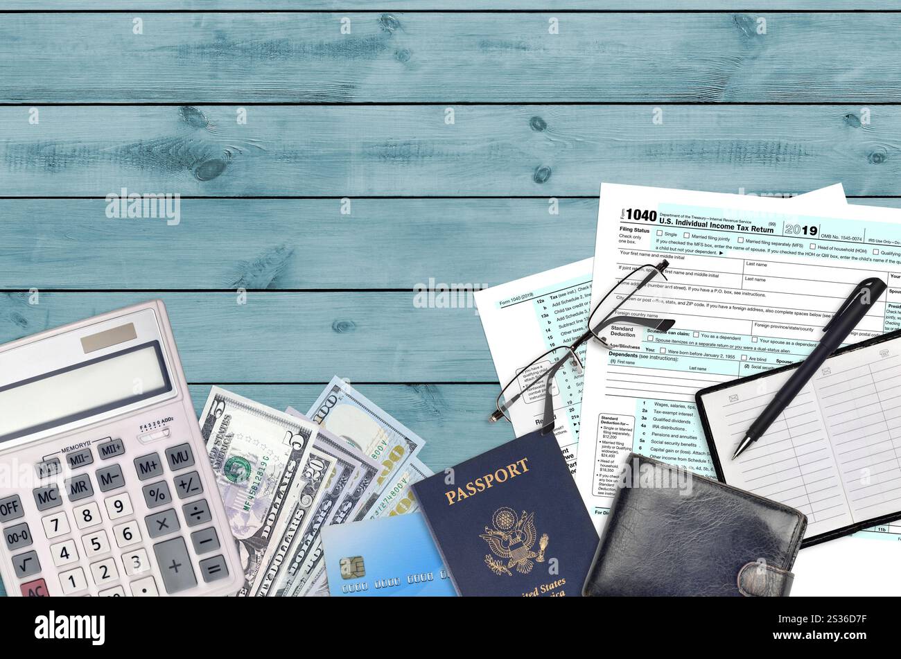 IRS form 1040 Individual income tax return lies on flat lay office ...