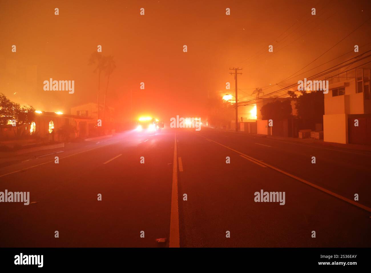 A view of the eerie orange glow as flames engulf residential areas in ...
