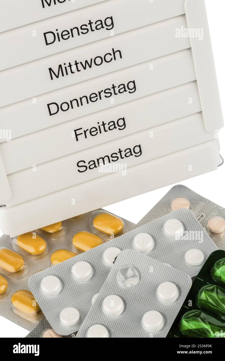 Tablet dispenser and tablets, symbol photo for therapy, prescription ...