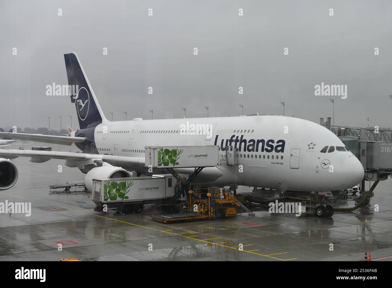 Lufthansa Airbus A380-800 in the rain at check-in position, satellite ...