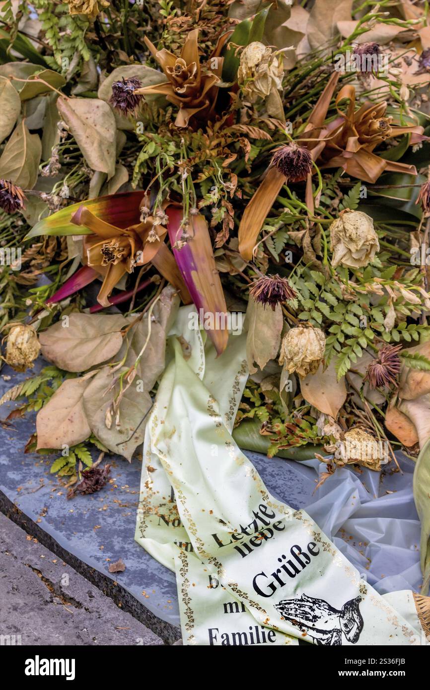 Withered wreath at the Barbarafriedhof cemetery in Linz, Austria. About ...