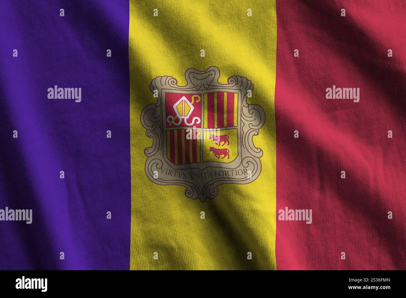 Andorra flag with big folds waving close up under the studio light ...