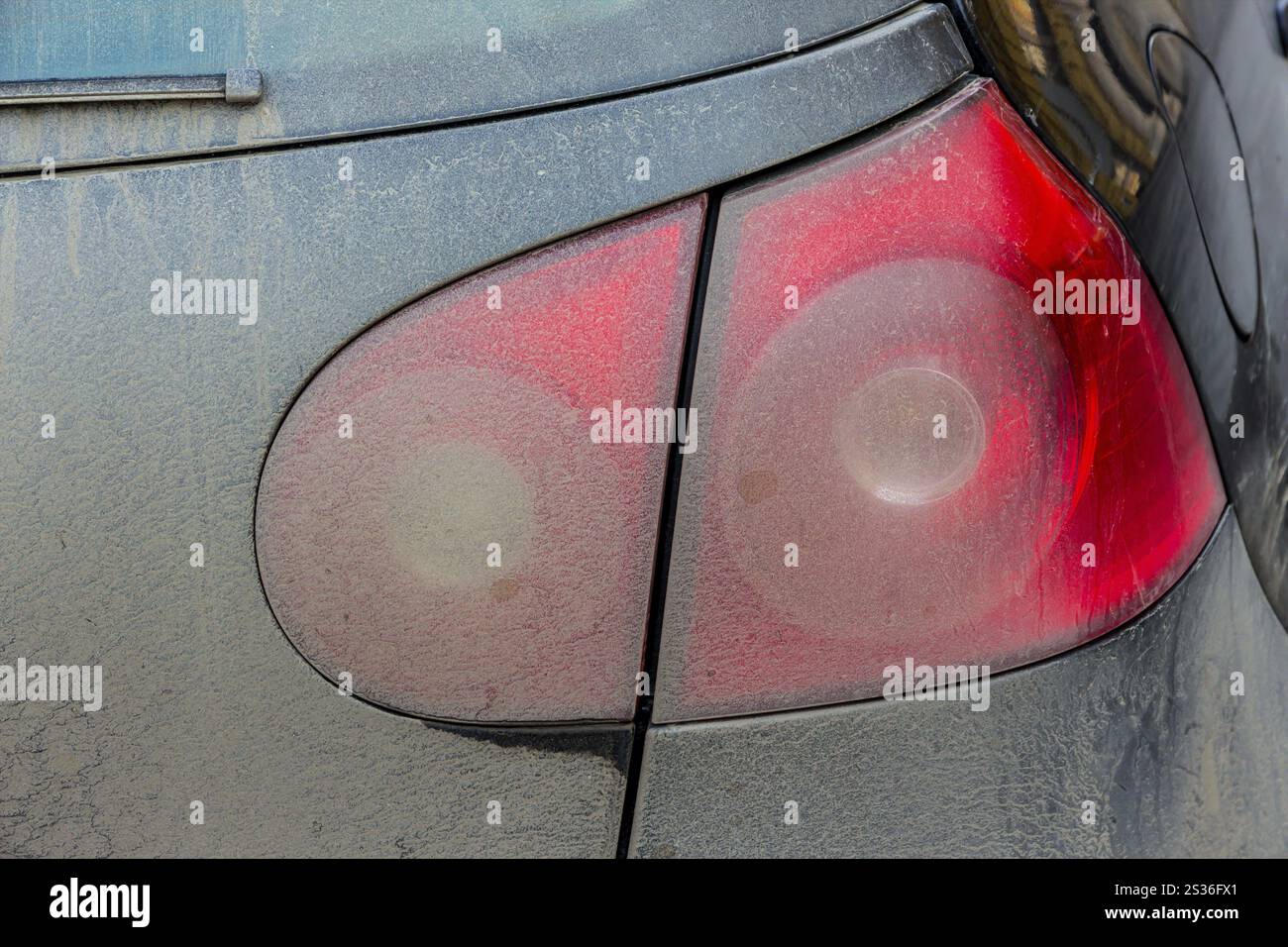 Dirty tail light on car, symbol of dirt, accident risk, traffic jam ...