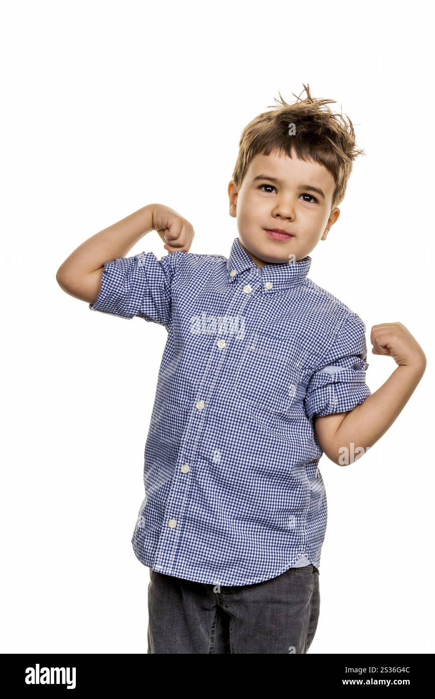 Little boy in pose, symbol of self-confidence, childhood, light ...