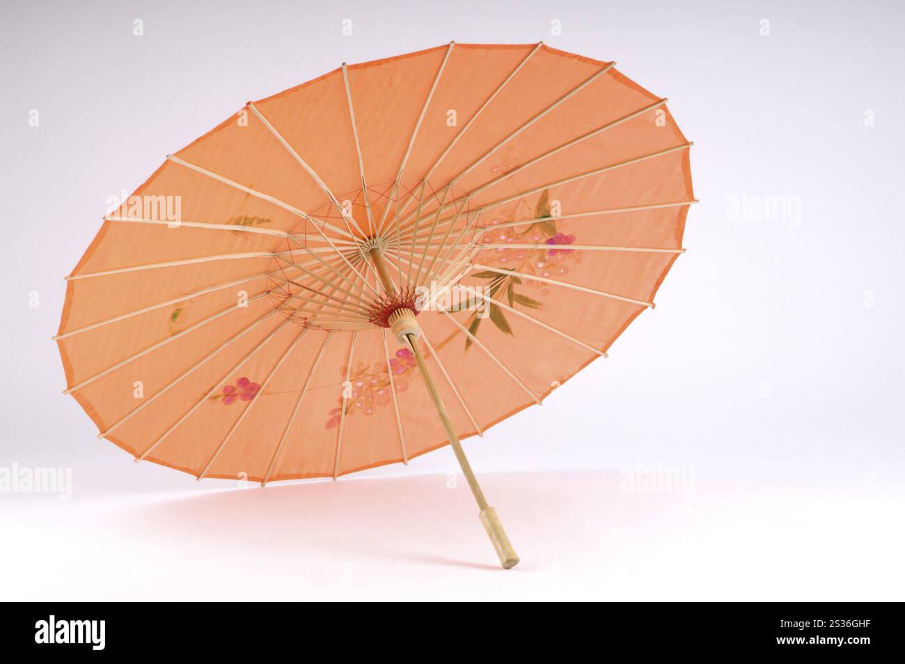 Orange Chinese parasol isolated on white background Stock Photo - Alamy