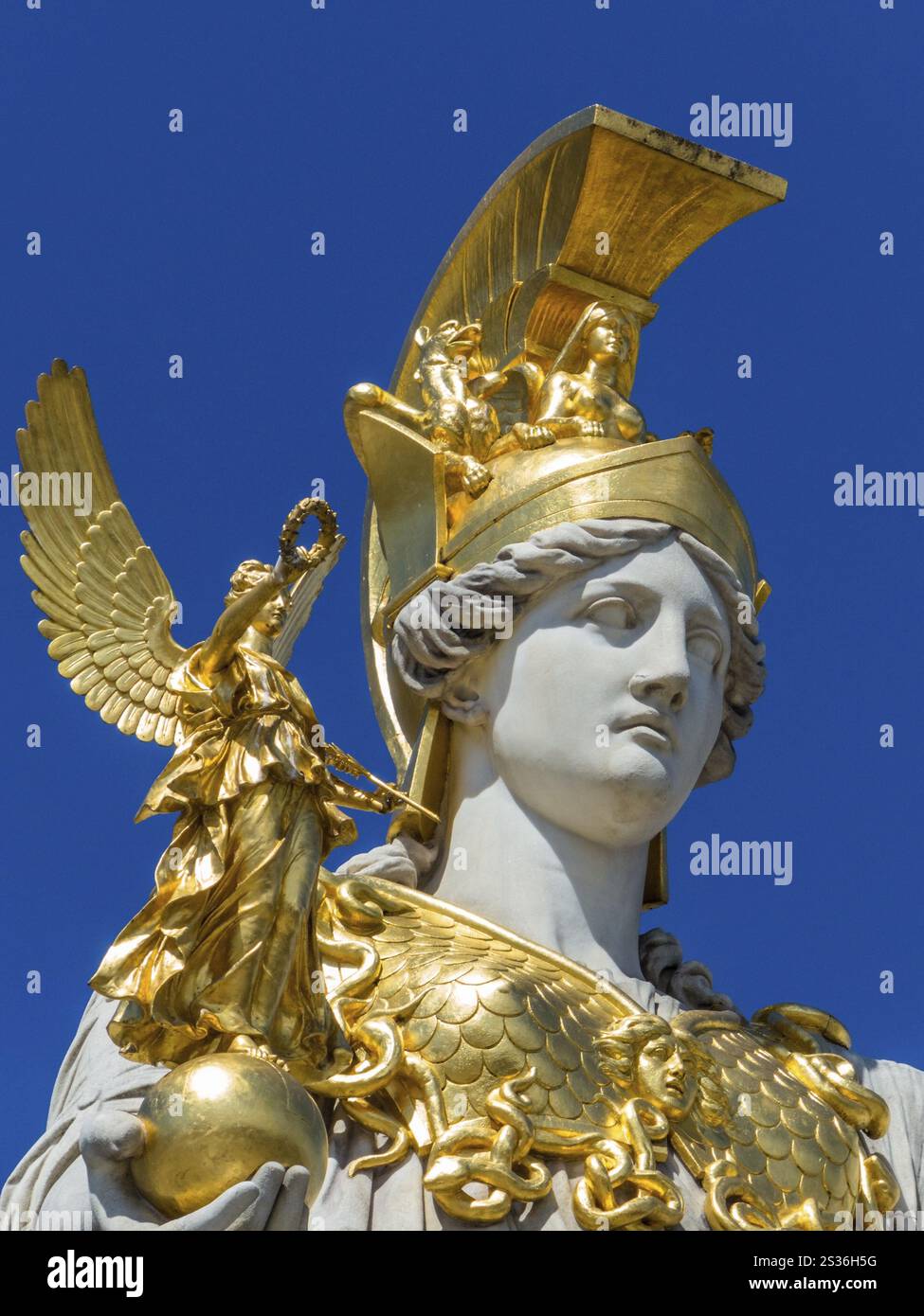 The parliament in Vienna, Austria. With the statue of Pallas Athena, the Greek goddess of wisdom ...