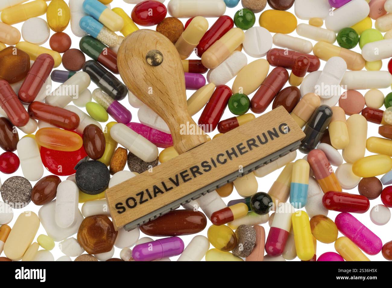 Stamp on colourful tablets, symbol for social insurance, medication and ...