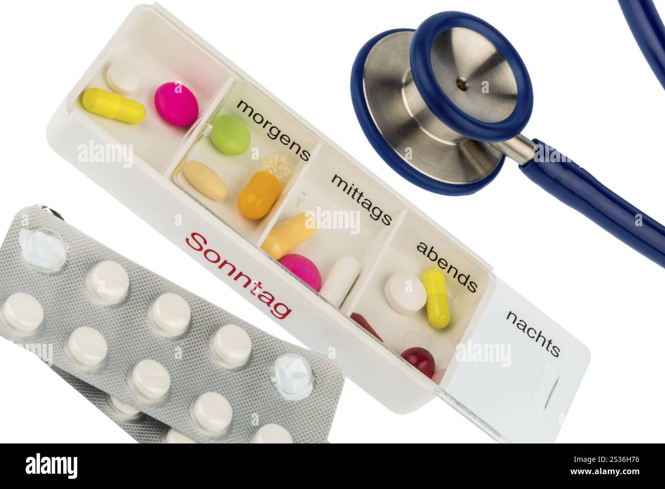 Tablet dispenser and stethoscope, symbolic photo for therapy ...