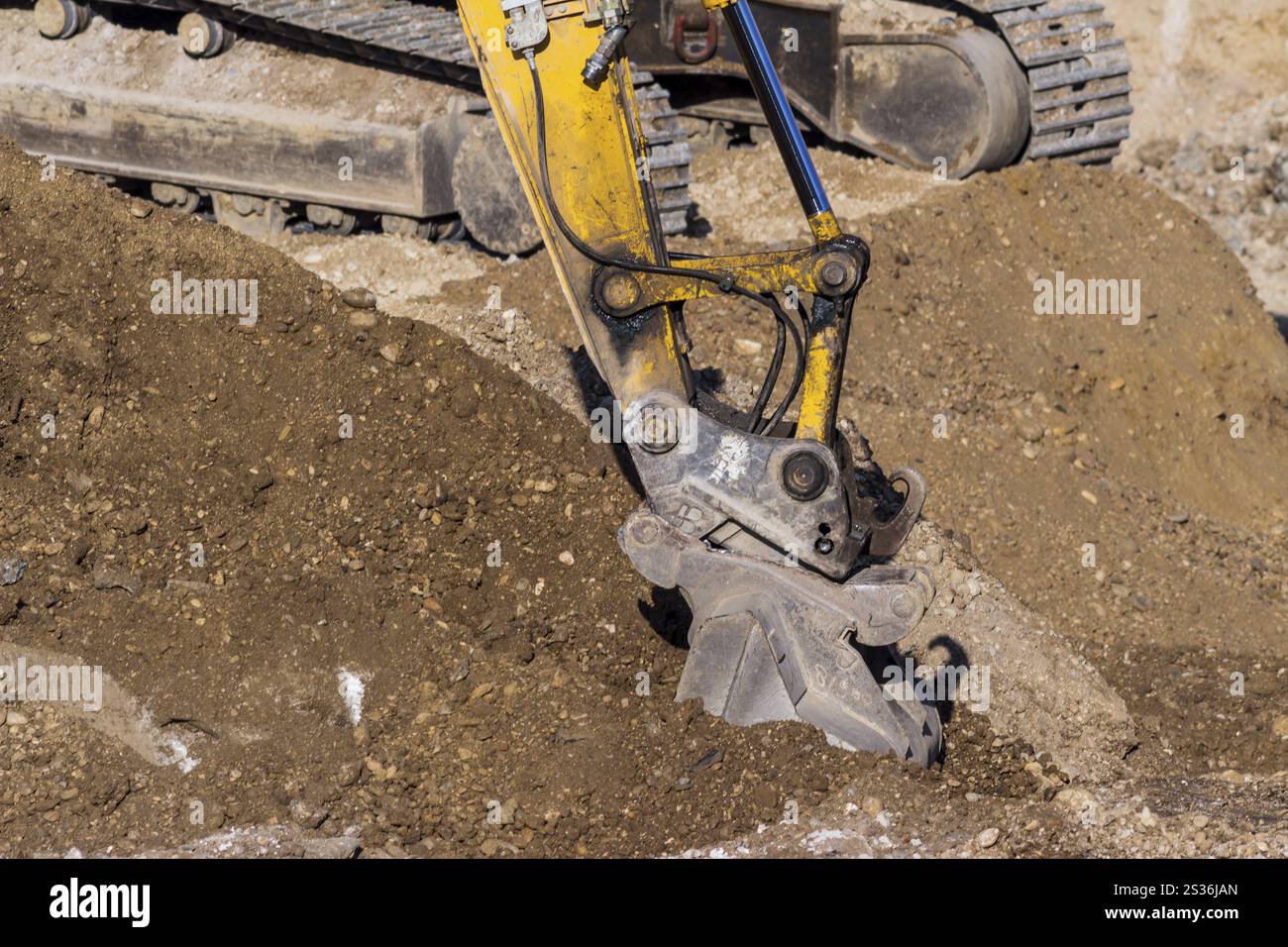 Excavator on a building site. Excavator shovel with earth, earthworks ...
