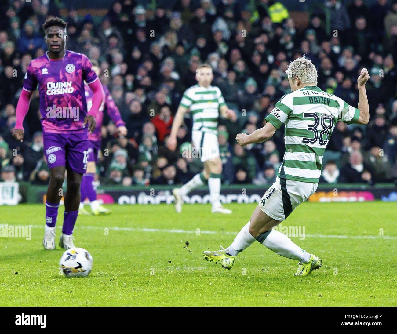Celtic's Daizen Maeda (R) opens the scoring in the first half of a ...