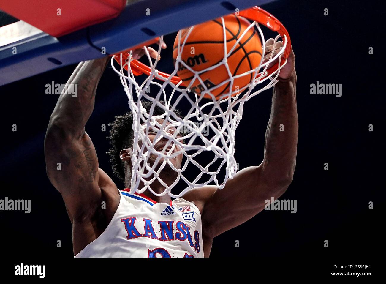 Kansas forward KJ Adams Jr. dunks the ball during the first half of an ...