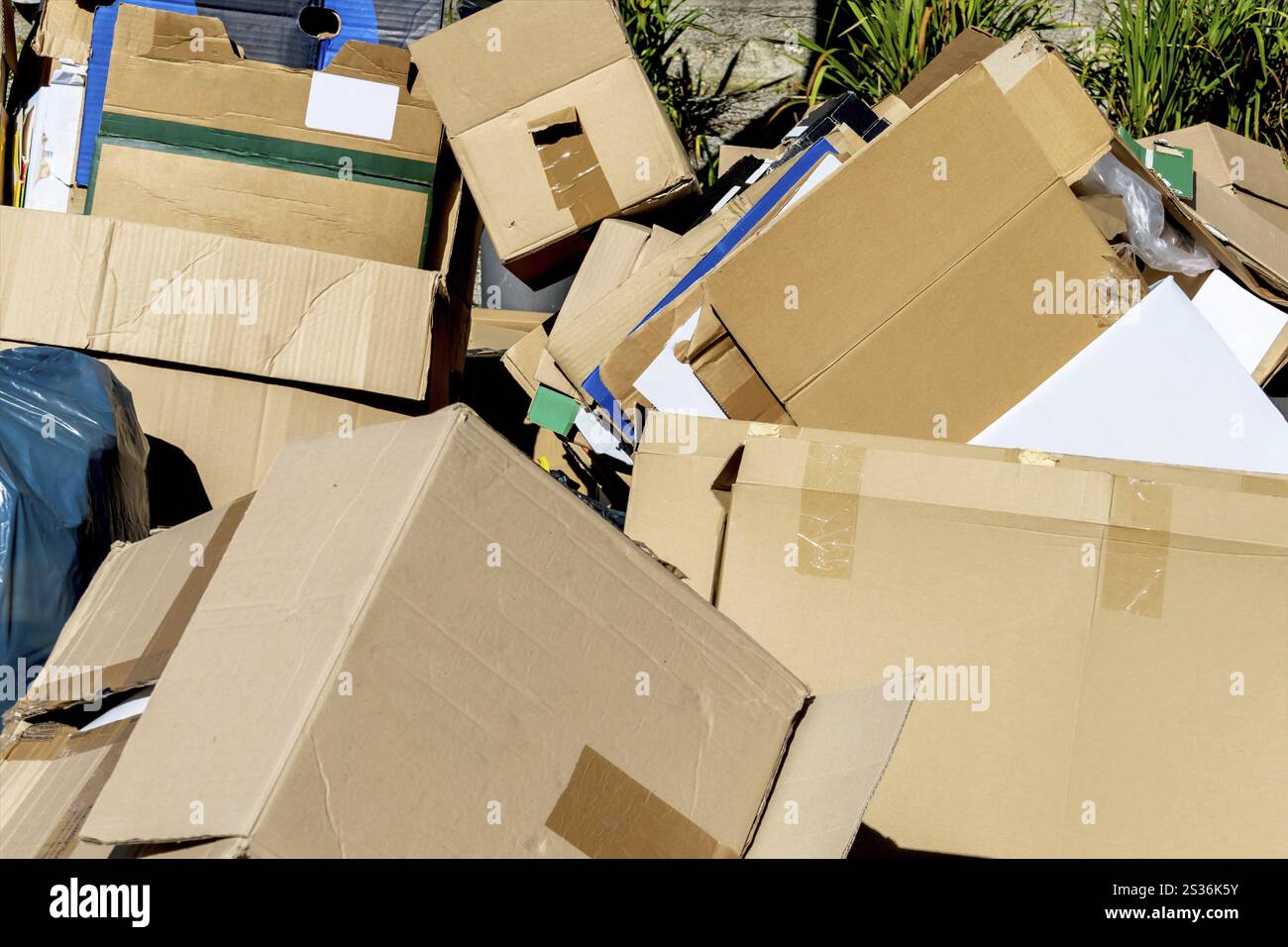 Cardboard boxes waiting to be collected by the waste collection service ...