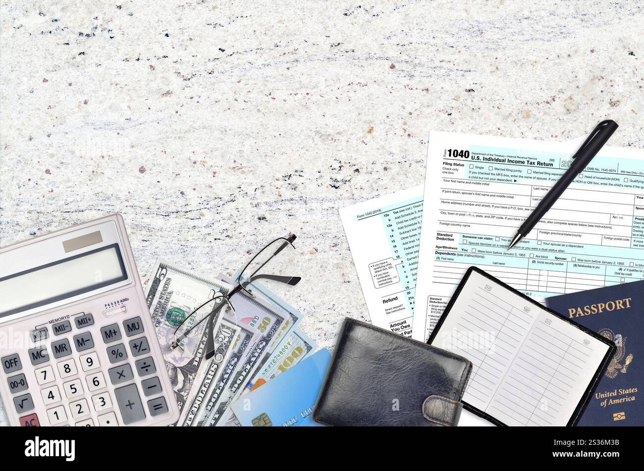 IRS form 1040 Individual income tax return lies on flat lay office ...