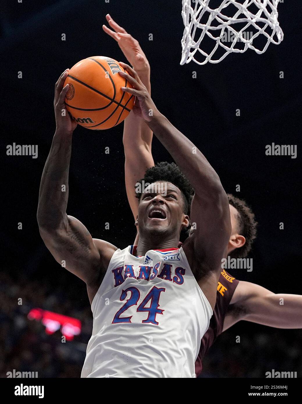 Kansas forward KJ Adams Jr. (24) shoots during the first half of an ...