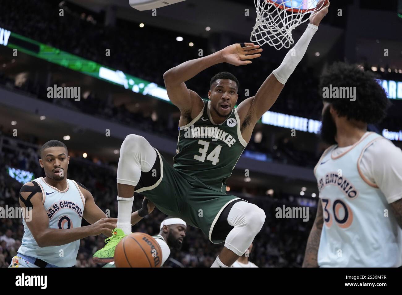 Milwaukee Bucks' Giannis Antetokounmpo dunks during the first half of ...