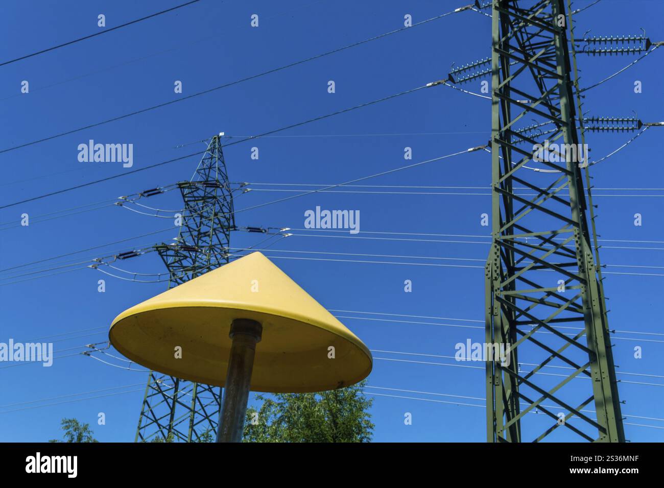 A gas pipeline and an electricity pylon of a high-voltage power line ...
