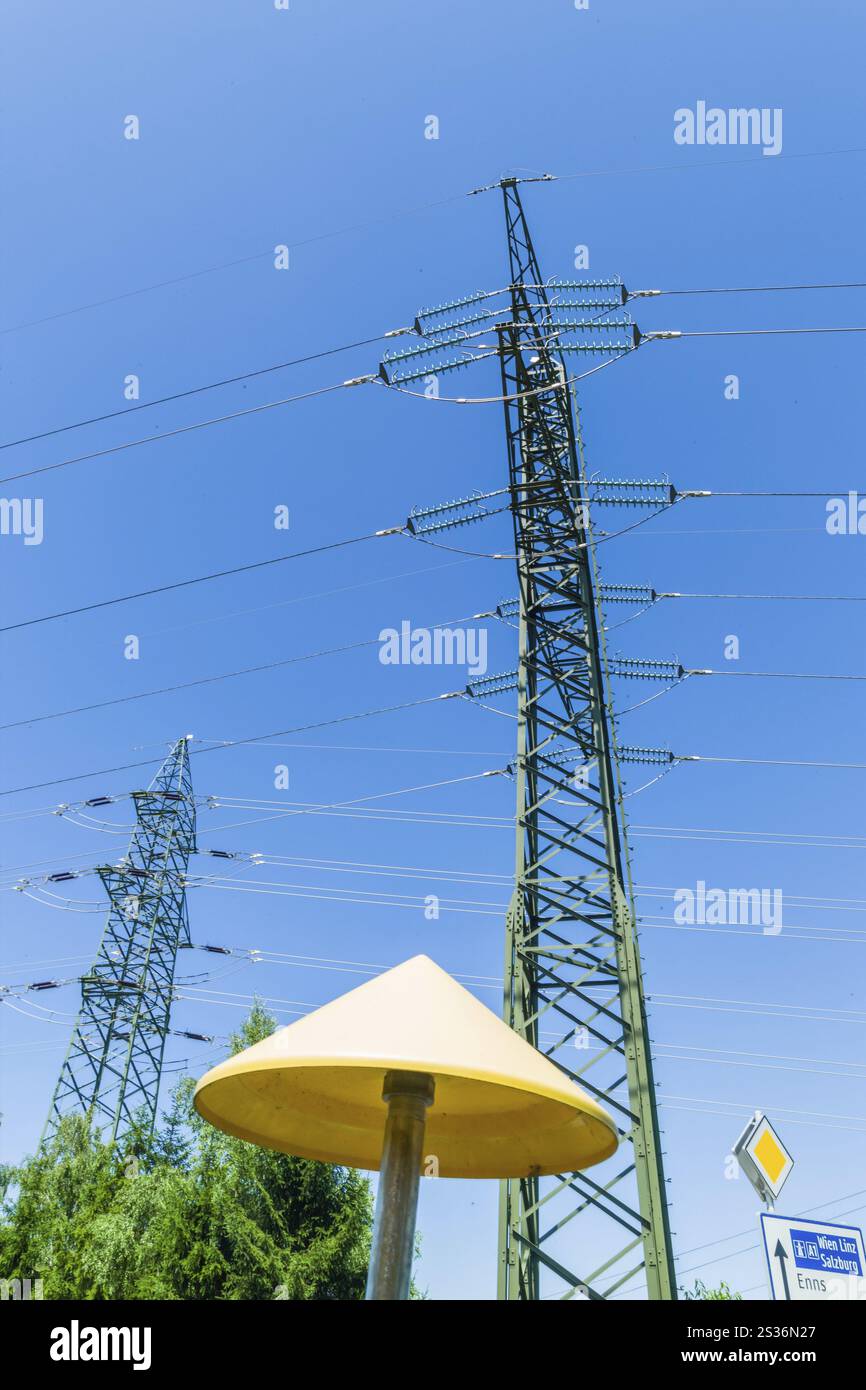 A gas pipeline and an electricity pylon of a high-voltage power line ...