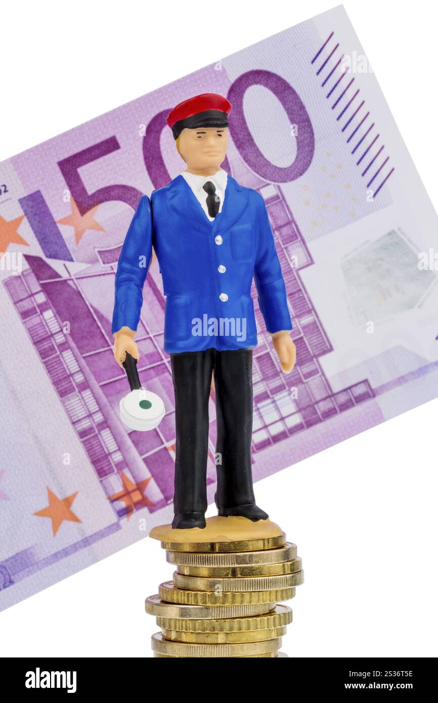 Railway employee on pile of money, symbolic photo for early retirement ...