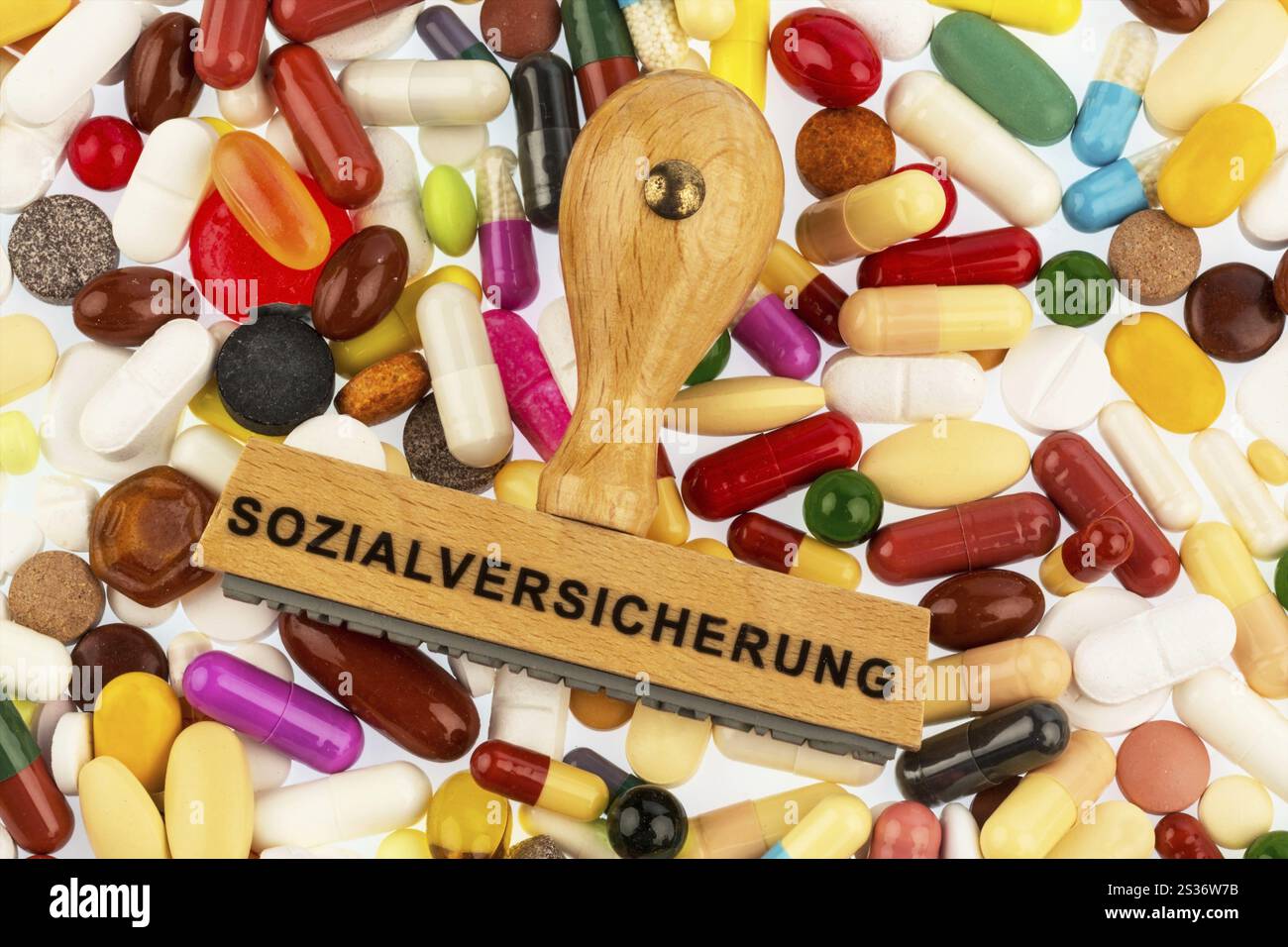 Stamp on colourful tablets, symbol for social insurance, medication and ...