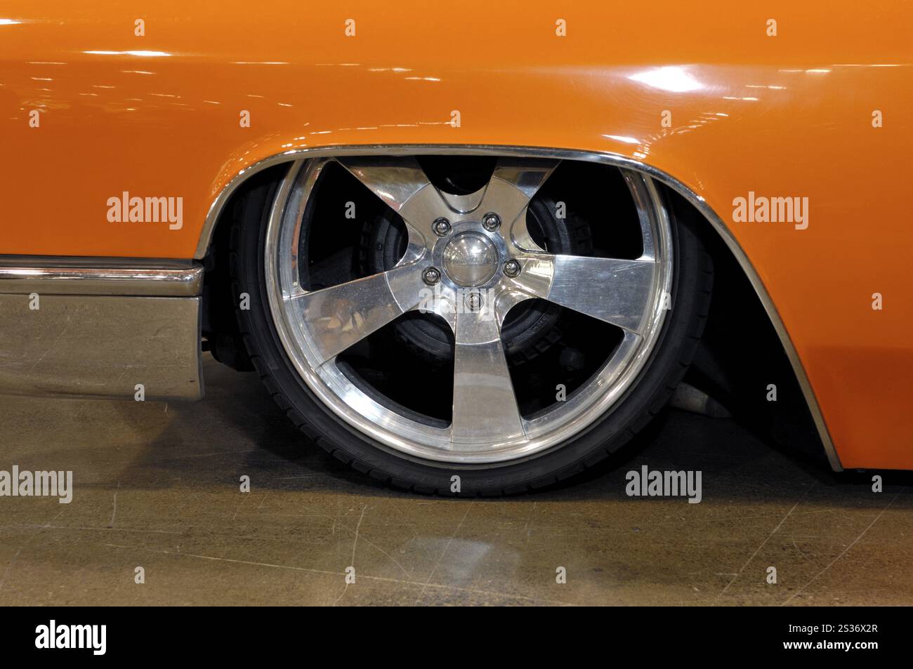 Low profile tires on custom orange 1967 Cadillac Coupe DeVille stylish restored classic retro ...