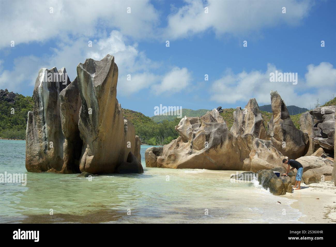 Seychelles island Curieuse with the famous granite rocks Stock Photo ...